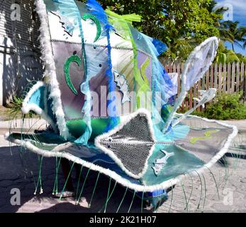 A male, Belizean dancer in an elaborate, blue, underwater-themed ...