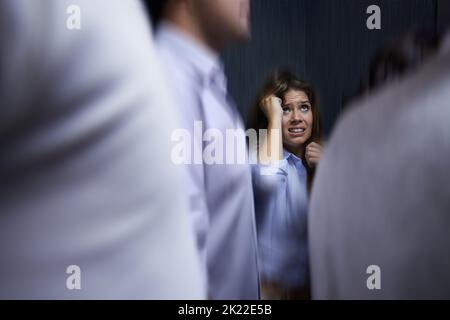 I have to get out of here. a fearful young woman feeling trapped by the ...
