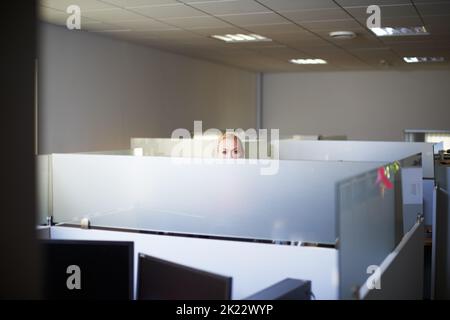 Young blonde woman at the office putting coin into piggy bank smiling ...