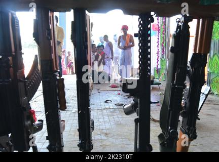 A priest blessing weapons belonging to TSR 2nd Battalion (Tripura State ...
