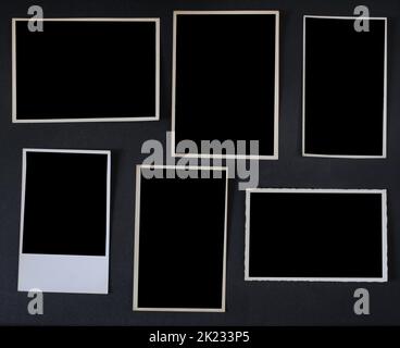 old empty photo frames, vintage photo prints on crumpled paper with ...