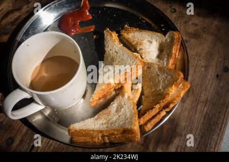 Grilled Bun- Butter or Muska Bun with Hot Indian spiced tea served in a ...