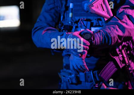 Modern warfare soldier checking navigation, time and other information ...