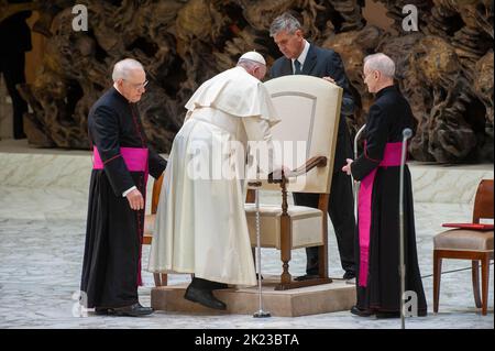 Pope butler Sandro Mariotti, left, pushes Pope Francis on a wheelchair ...
