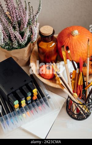 School supplies, pumpkin, autumn leaves and text back to school on the ...