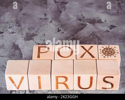 Epidemic or spread of disease concept as POX inscription on wood blocks ...
