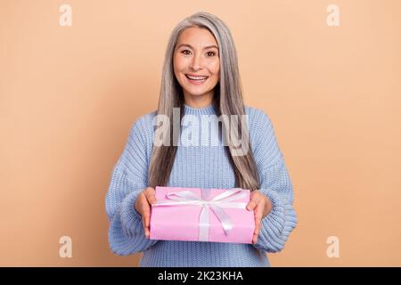 Photo of sweet excited girl dressed orange t-shirt rising heart like ...