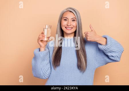 Photo of funky cool girl dressed green clothes shooting money gun empty ...