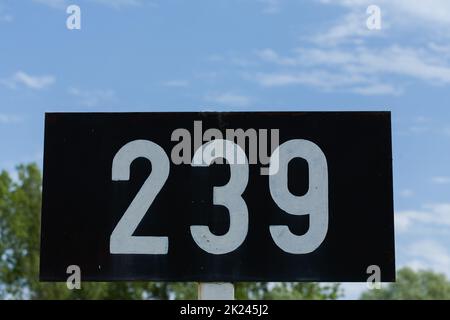 Low angle shot of a signpost on an old tower background Stock Photo - Alamy