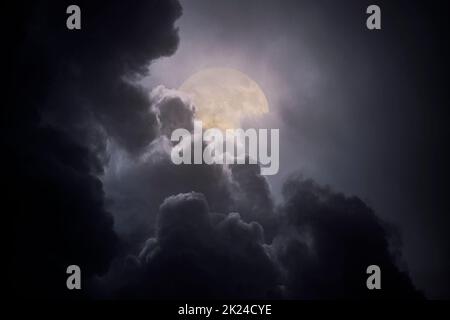 Dark, cloudy ad creepy full moon night Stock Photo - Alamy