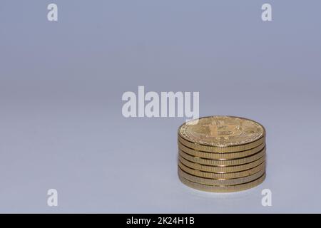 stack of silver valueable ether coins from crypto currency with gray ...