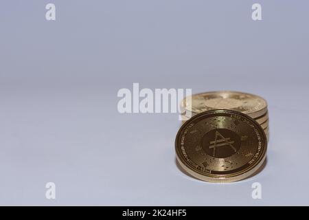 stack of silver valueable ether coins from crypto currency with gray ...