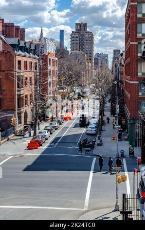 Chelsea city Street with lots of parked cars next to the street and ...