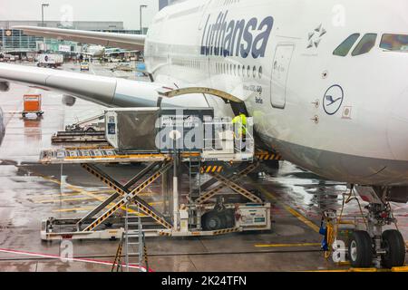 Ground crew loading A380 aircraft at airport Stock Photo - Alamy