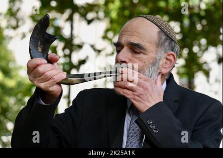London, UK. Rabbi Jonathan Wittenberg. Rabbi blowing Shofar. Rally in ...