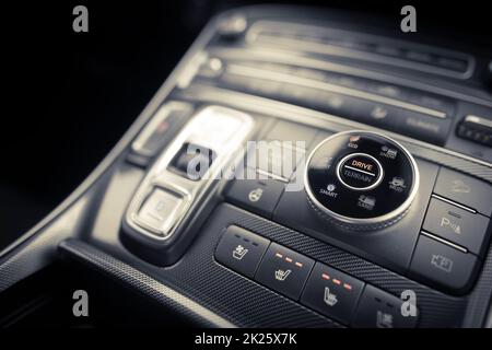 Modern car drive mode selector button Stock Photo - Alamy