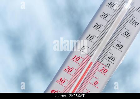 Thermometer in winter in the cold on snow and analyzes low negative air ...