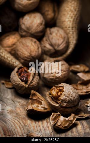 walnuts cracked open with a vintage wooden nut cracker Stock Photo - Alamy