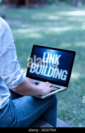 Woman typing on a laptop keyword Stock Photo - Alamy
