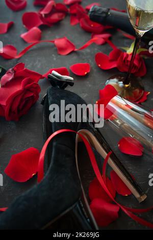 Romantic valentines day rendezvous with red roses and black stilettos ...