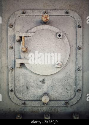 Rusty steel hatch door secured with nuts and bolts Stock Photo - Alamy