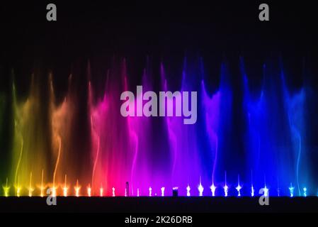 Beautiful fountain dancing show with reflection on water at night Stock ...