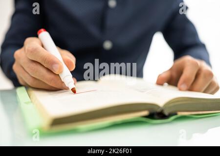 Man Hand With Highlighter Reading Book Stock Photo - Alamy