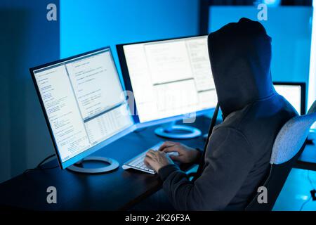Hacker Using Computer To Write Cyber Security Exploit Software Program ...