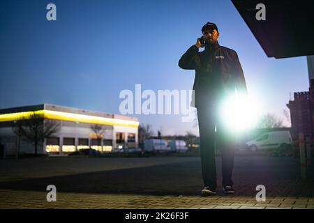 Security Guard Walking Building Perimeter With Flashlight At Night ...