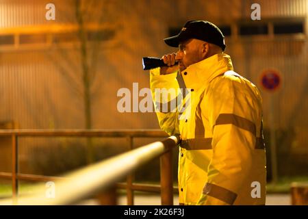 Security Guard Walking Building Perimeter With Flashlight At Night ...