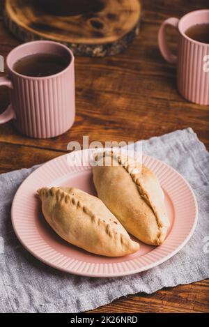 Oven Baked Cabbage Pies on Plate Stock Photo - Alamy