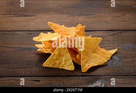 Triangular corn tortilla chips with cheese salt and chili. Isolated on ...