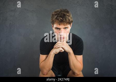 Angry man on his knees Stock Photo - Alamy