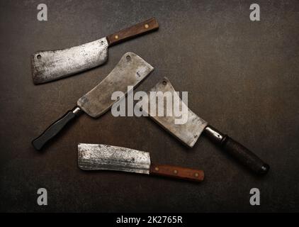 Vintage Butcher meat cleavers on dark wooden background Stock Photo - Alamy