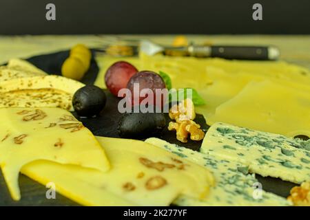 Cheese plat. Emmental, Camembert cheese, blue cheese, bread sticks ...