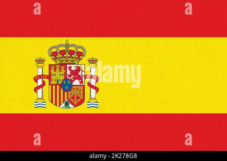 Spanish flag colored ribbon on beige background in a design with copy ...