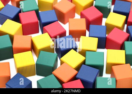 building blocks scattered on a white background Stock Photo - Alamy