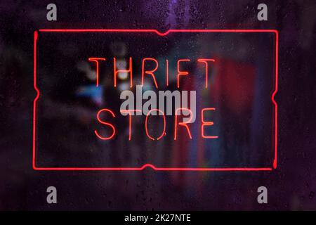 Vintage Neon Thrift Store Sign in Rainy Window Stock Photo - Alamy