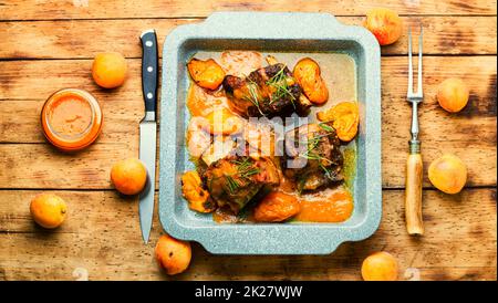Beef ribs stewed in apricots. Veal meat with fruit sauce Stock Photo ...
