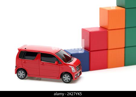 Small toy car and wooden colorful building blocks on white background ...