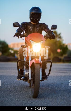 Male student poses on motorbike, motorcycle school Stock Photo - Alamy