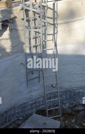 Ladder leading up from a pit Stock Photo - Alamy
