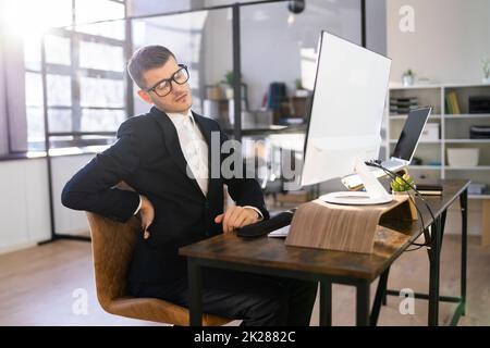 Bad Posture Office Desk Chair Back Pain Stock Photo - Alamy