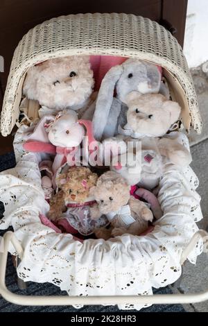 stuffed toys in the old fashioned buggy Stock Photo - Alamy