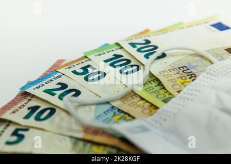 Euro money banknotes with a face mask Stock Photo - Alamy