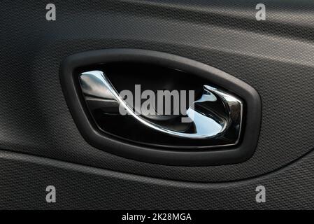 Car door handle inside, closeup view. Interior of modern car with door ...