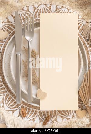 Wedding table place on bohemian placemat with horizontal blank card ...