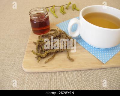 Herbal tea with hazel catkins, hazel flowers from hazel bush Stock ...