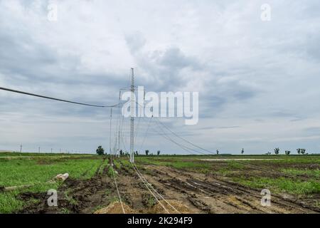 Assembly and installation of new support of a power line Stock Photo ...