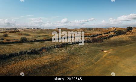 Irish coastline dunes with a moody sky over the beach. Portmarnock ...